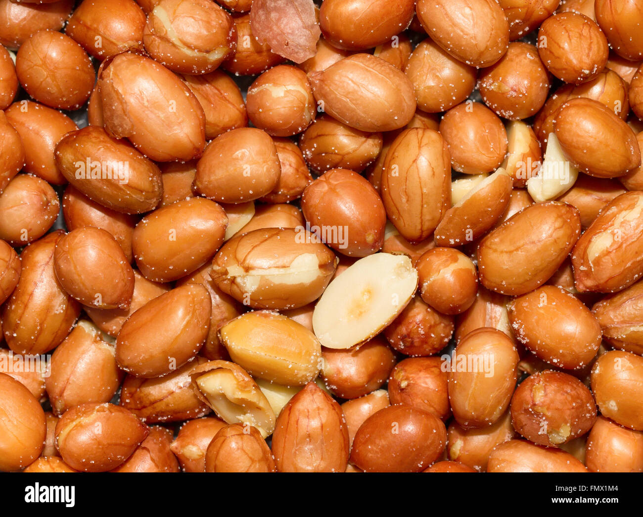 Stack of unshelled peanuts, salted - Food background Stock Photo - Alamy