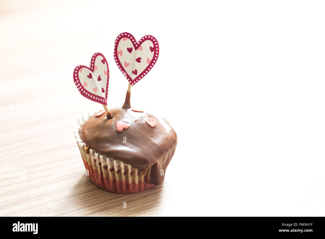 Chocolate muffin with topping, Valentine love dessert Stock Photo - Alamy