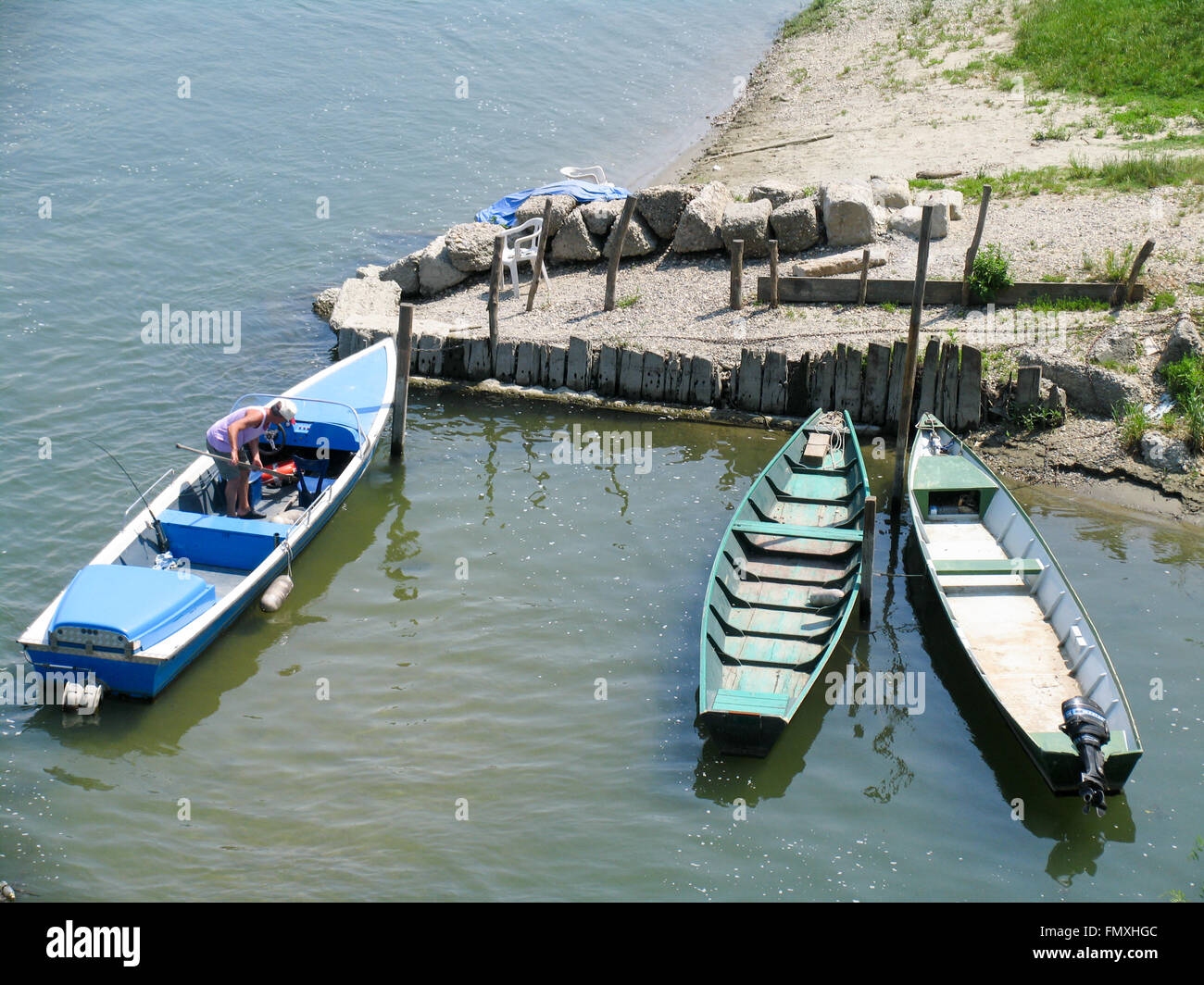 Small wooden flat bottom boats on the banks of the Po River Stock Photo ...