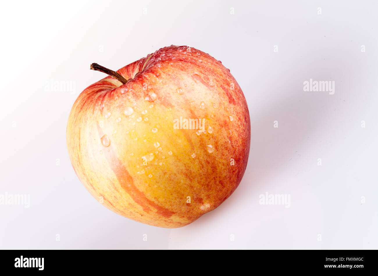 one yellow apple with isolated background Stock Photo - Alamy