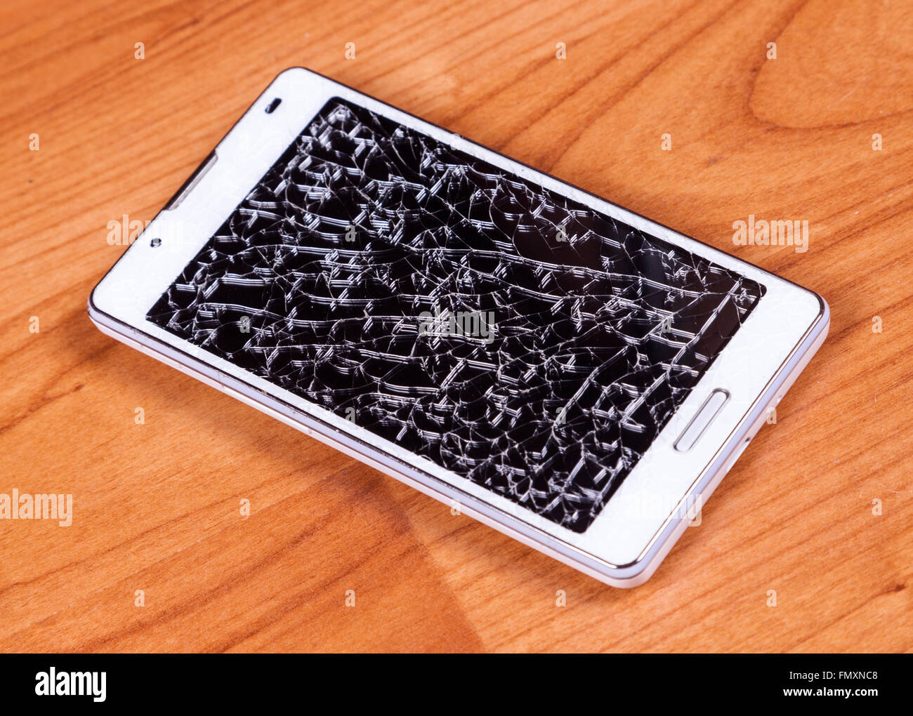 broken mobile phone on wood ground Stock Photo - Alamy