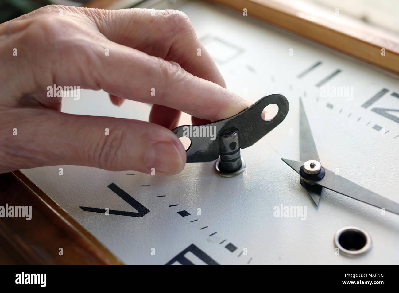 Winding a clock hi-res stock photography and images - Alamy