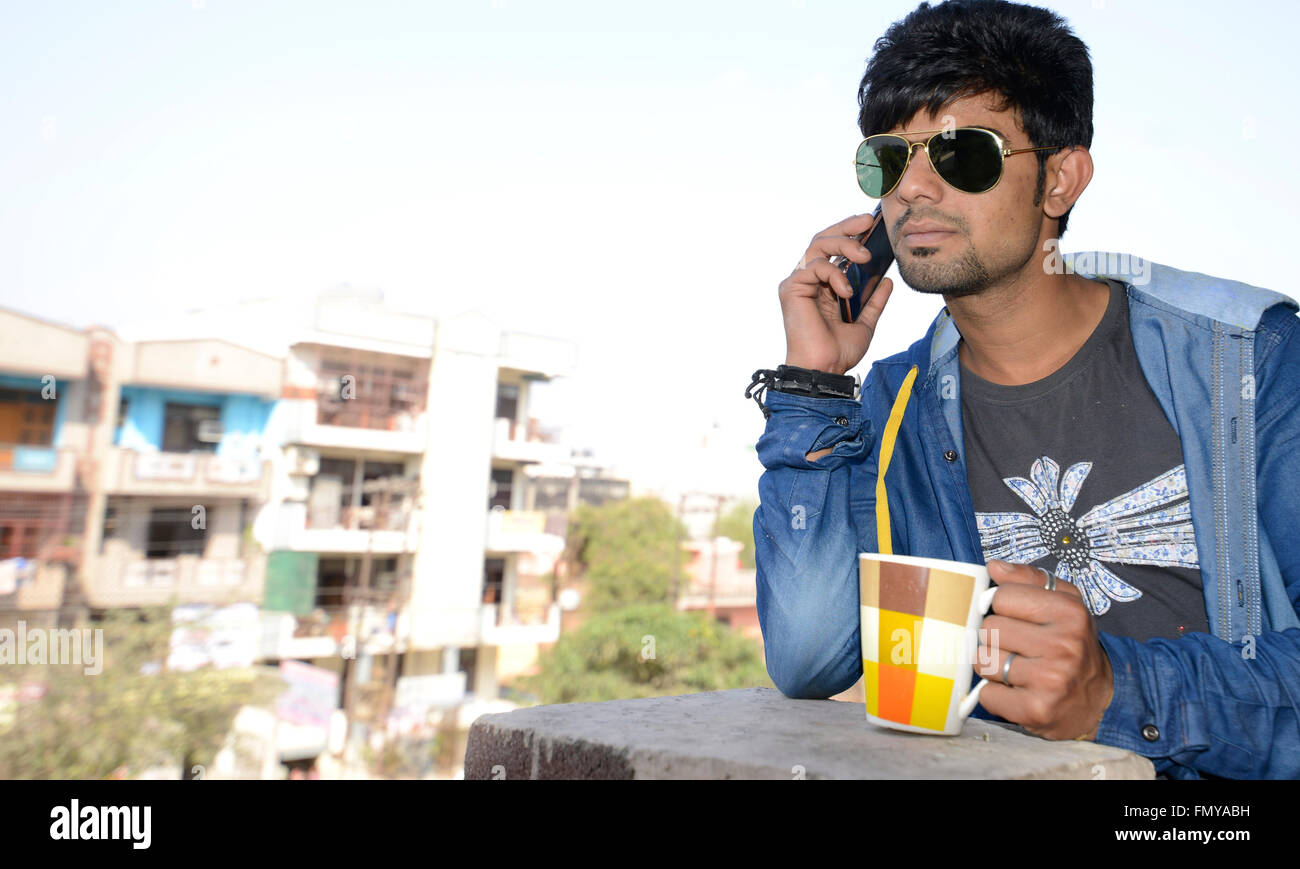 Handsome guy using phone Stock Photo - Alamy