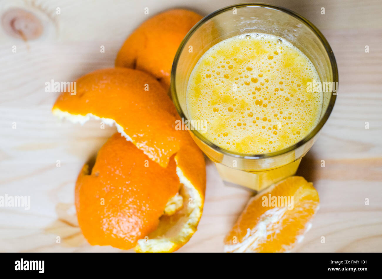 fresh mixed orange juice on the wooden table Stock Photo - Alamy