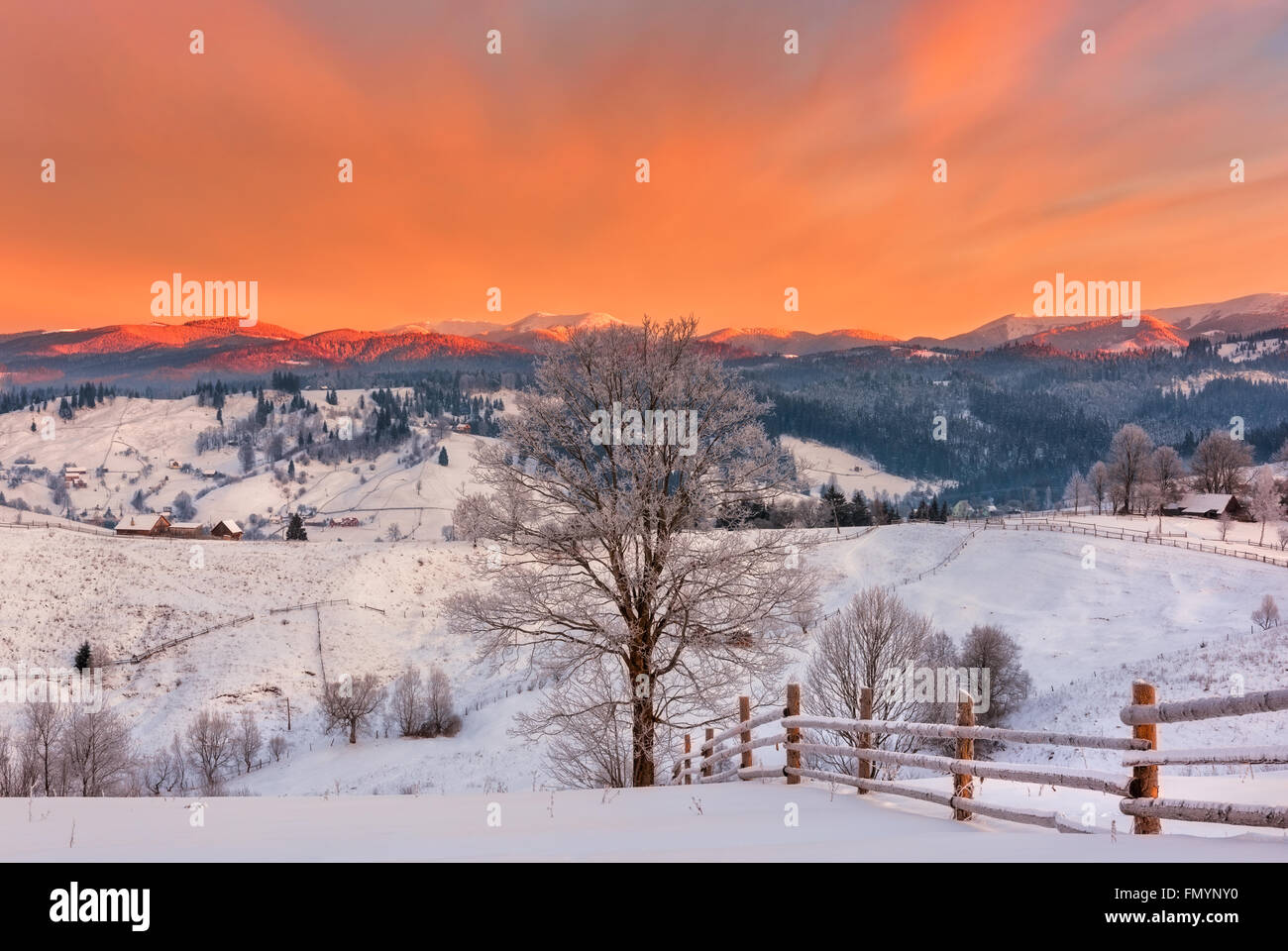 Fantastic winter mountain landscape with snow and fiery sky Stock Photo ...