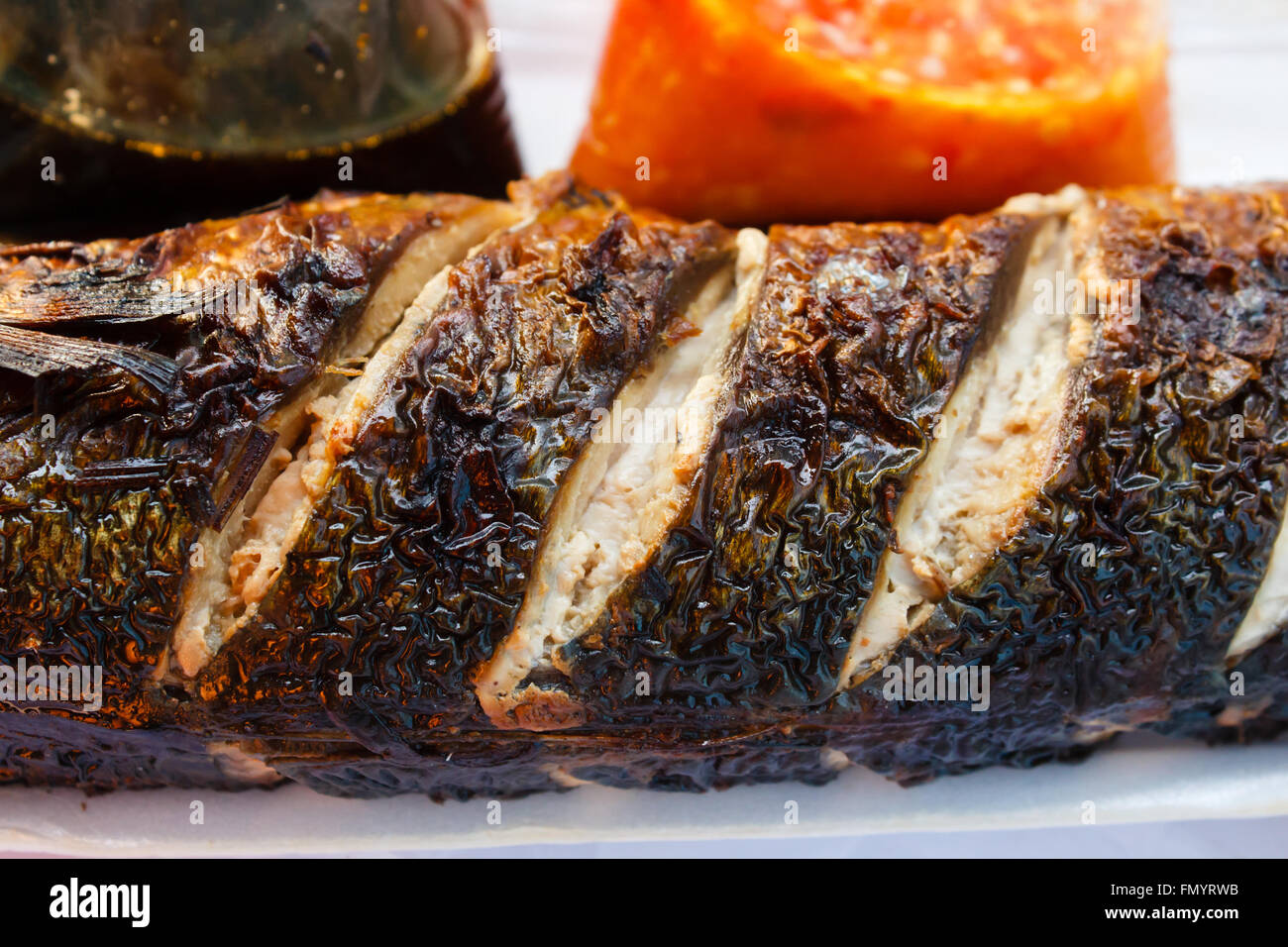 Grilled saba fish with sweet sauce, thai style Stock Photo - Alamy