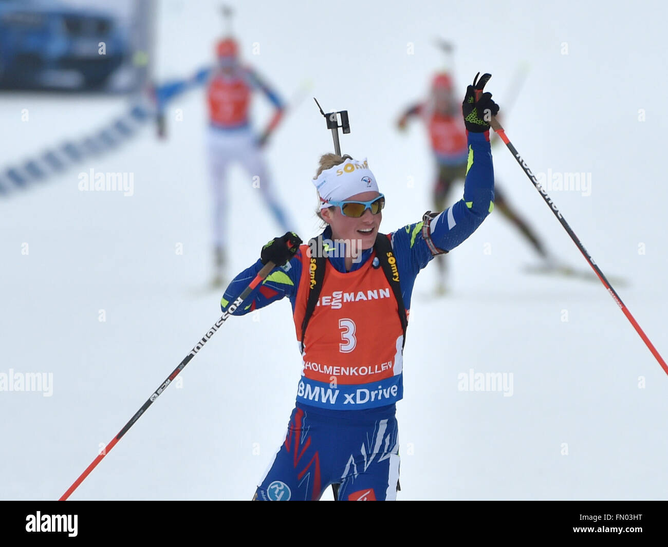 Winner Marie Dorin-Habert from France celebrates after crossing the ...