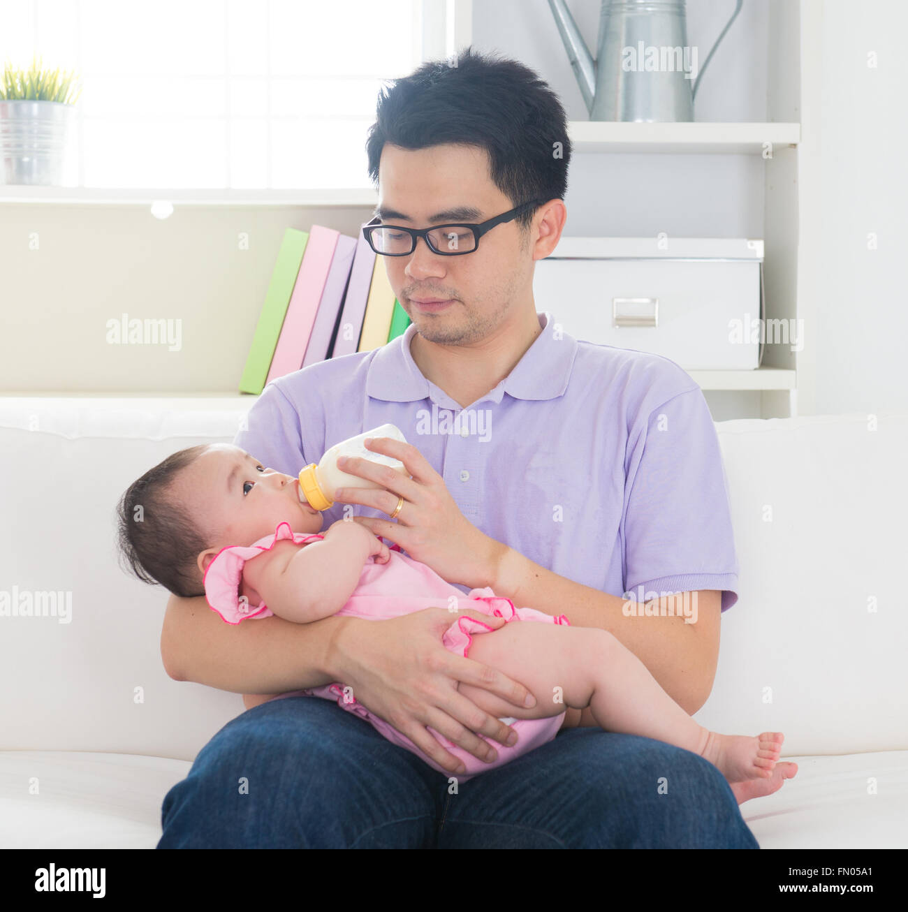 asian father nursing Stock Photo - Alamy