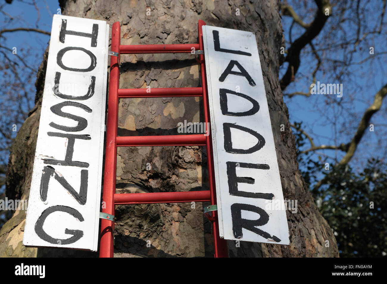 London, UK. 13th March, 2016. A "Housing Ladder" banner as thousands ...