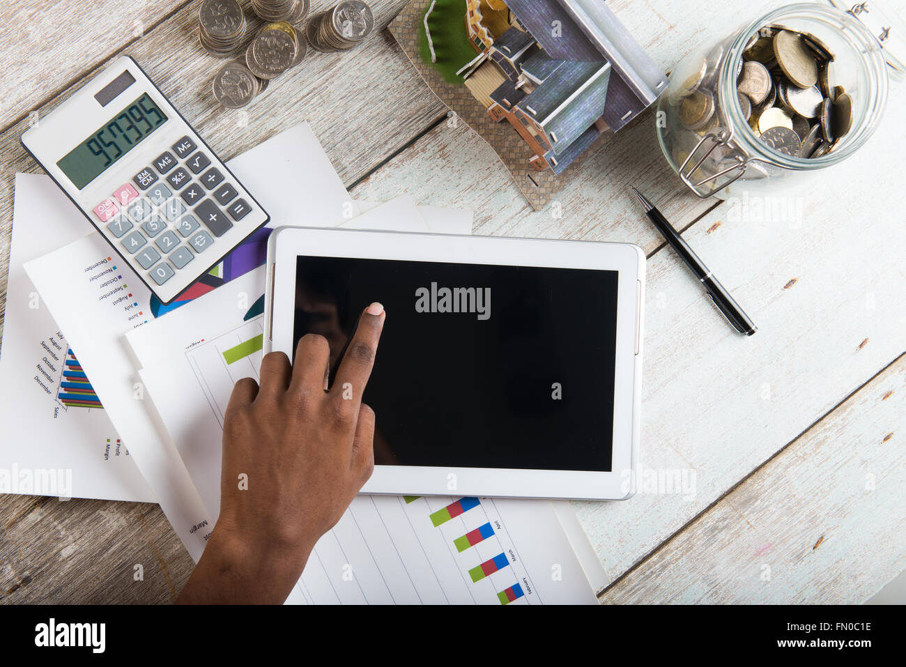 finance concept photo with coins and computer Stock Photo - Alamy