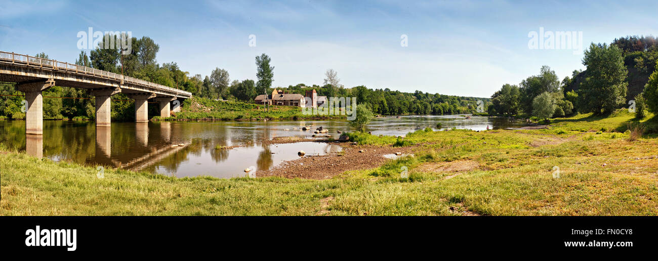 Bridge and old buildings on the spring riverbank of south bug Stock ...