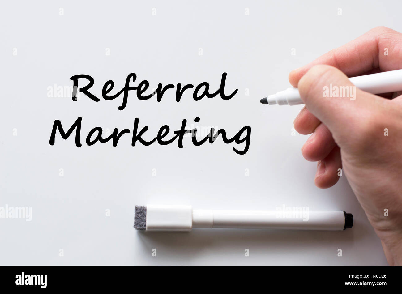 Human hand writing referral marketing on whiteboard Stock Photo - Alamy