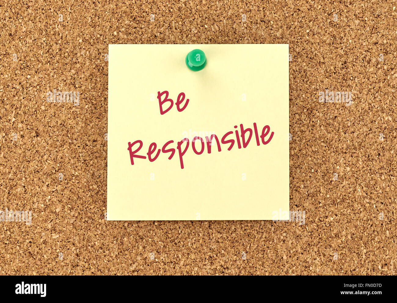 The phrase Be Responsible in red text on a yellow sticky note posted to ...