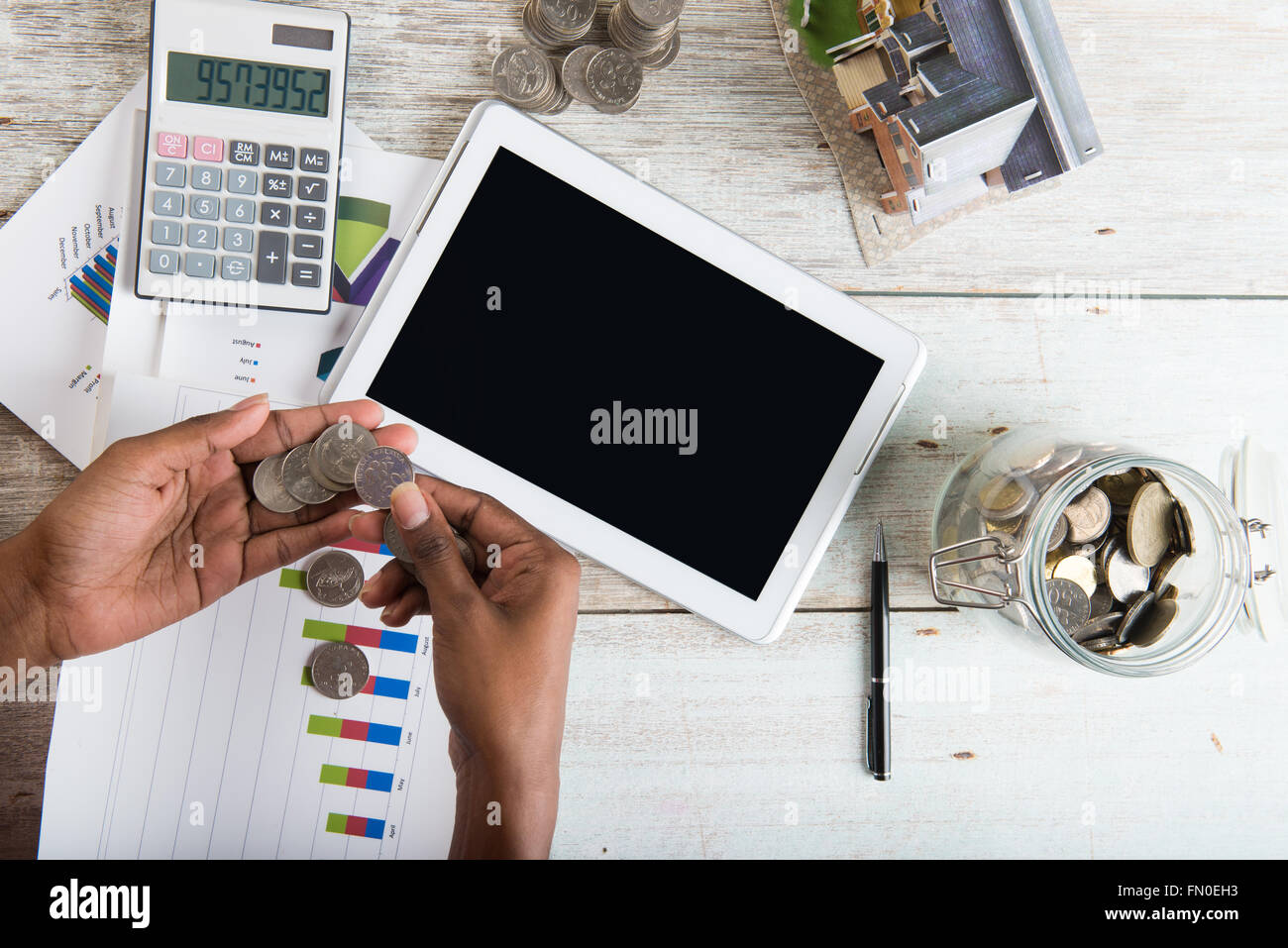 finance concept photo with coins and computer Stock Photo - Alamy