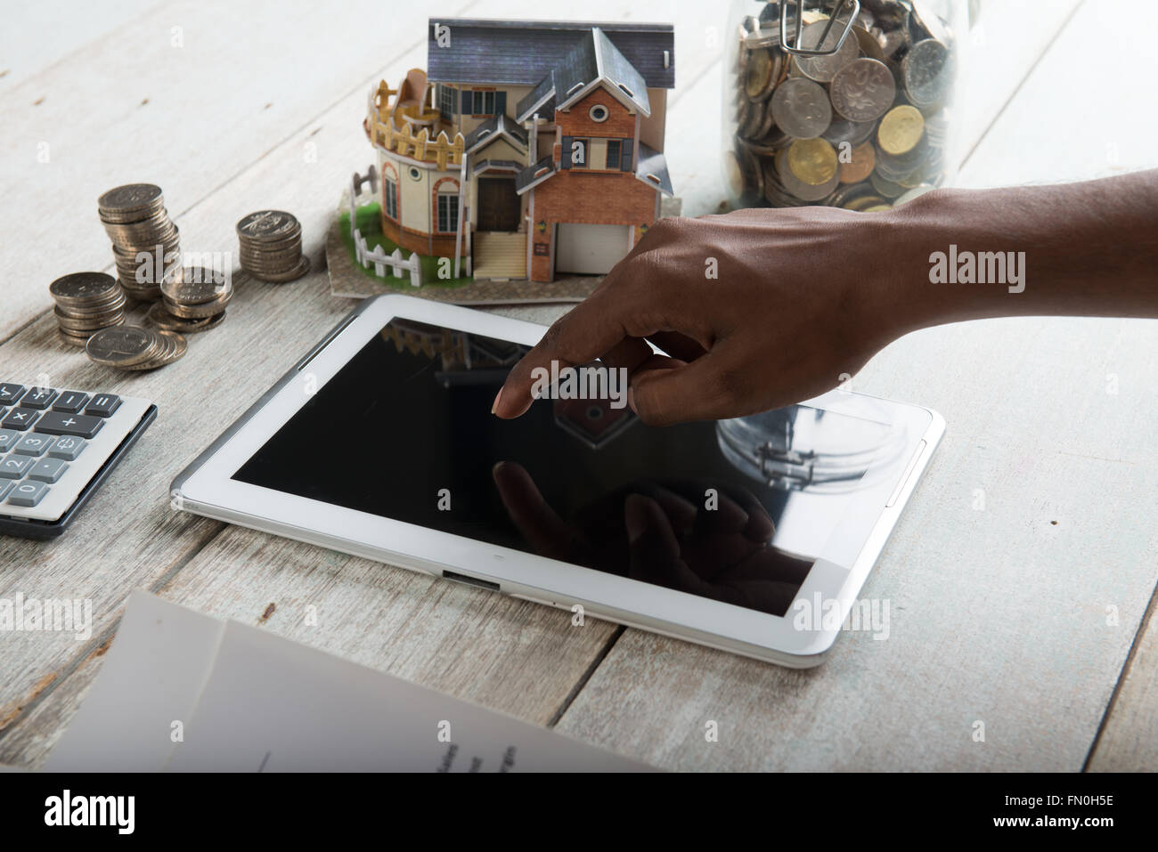 finance concept photo with coins and computer Stock Photo - Alamy