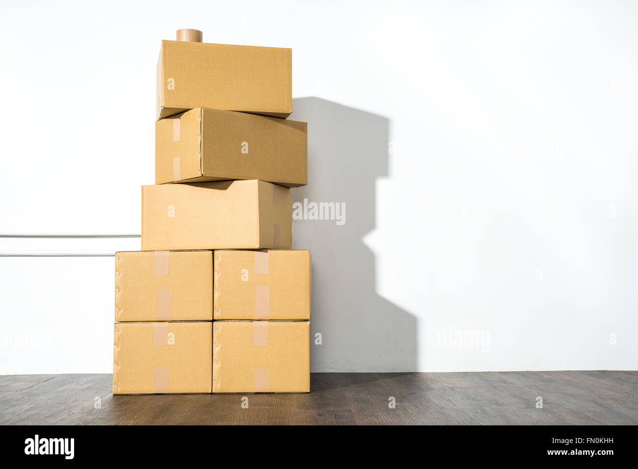 Pile of cardboard boxes on white background with box shadow, nobody ...