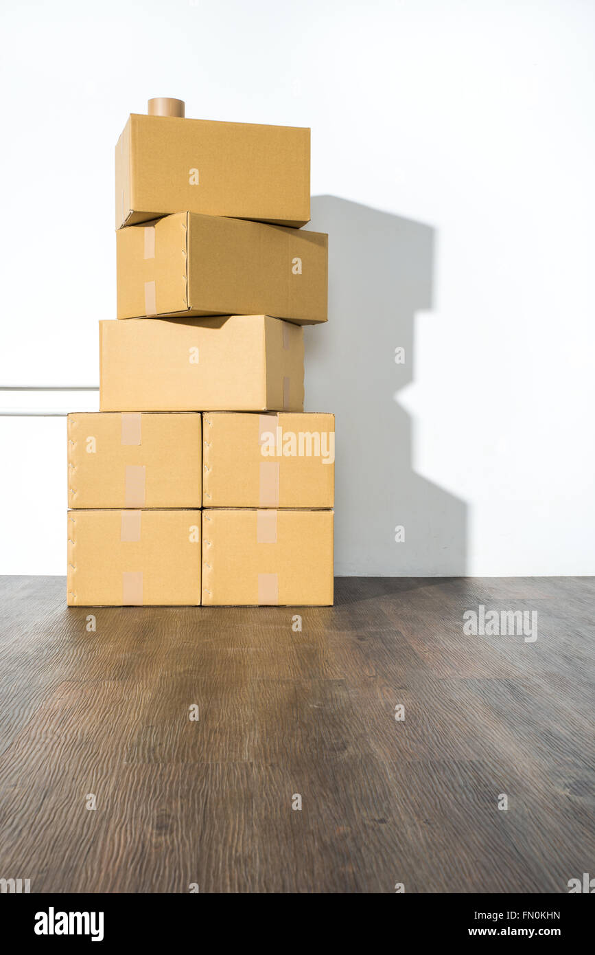 Pile of cardboard boxes on white background with box shadow, nobody ...