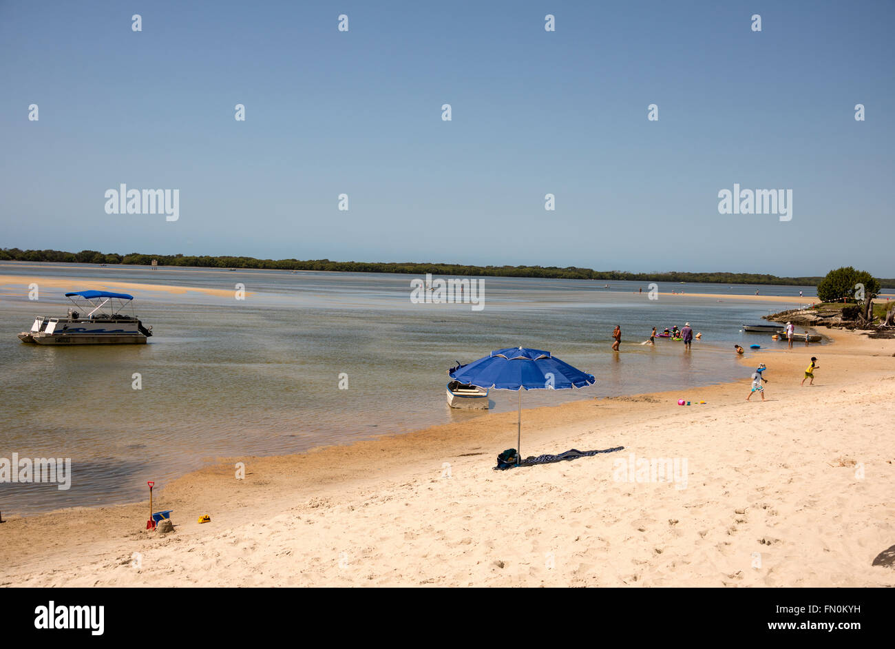 The shallow bay on Golden Beach at Caloundra on the Sunshine Coast in ...