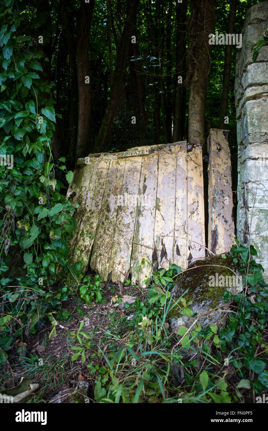 An old gate in a stone wall with private sign Stock Photo - Alamy