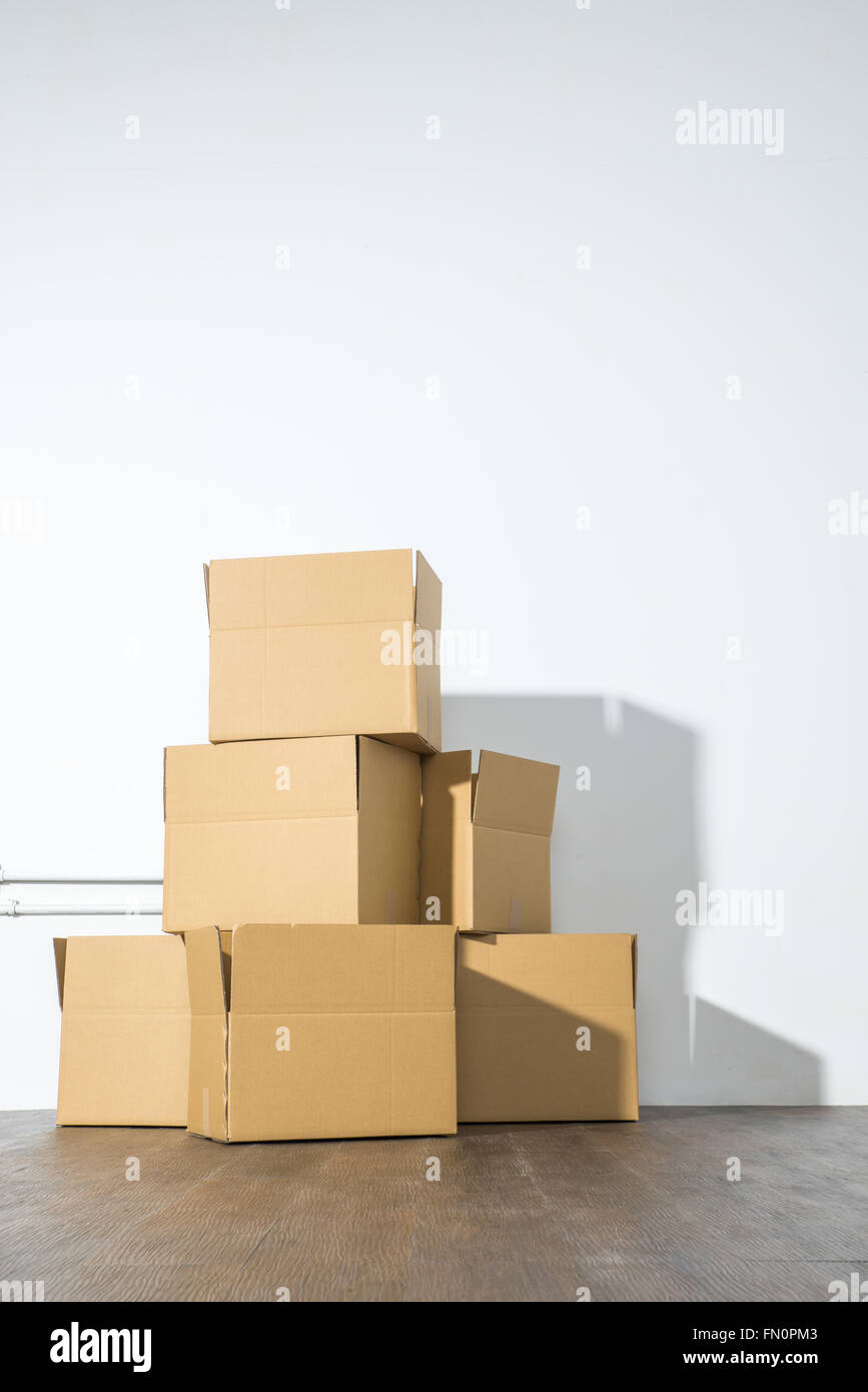 Pile of cardboard boxes on white background with box shadow, nobody ...