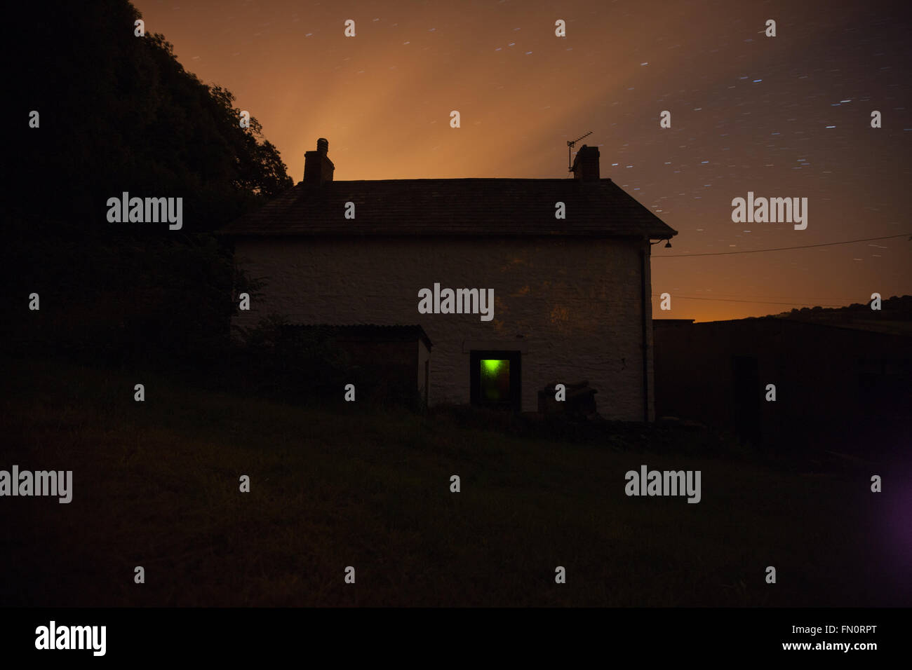 Light pollution in Carmarthenshire.Green light is from the on switch on ...