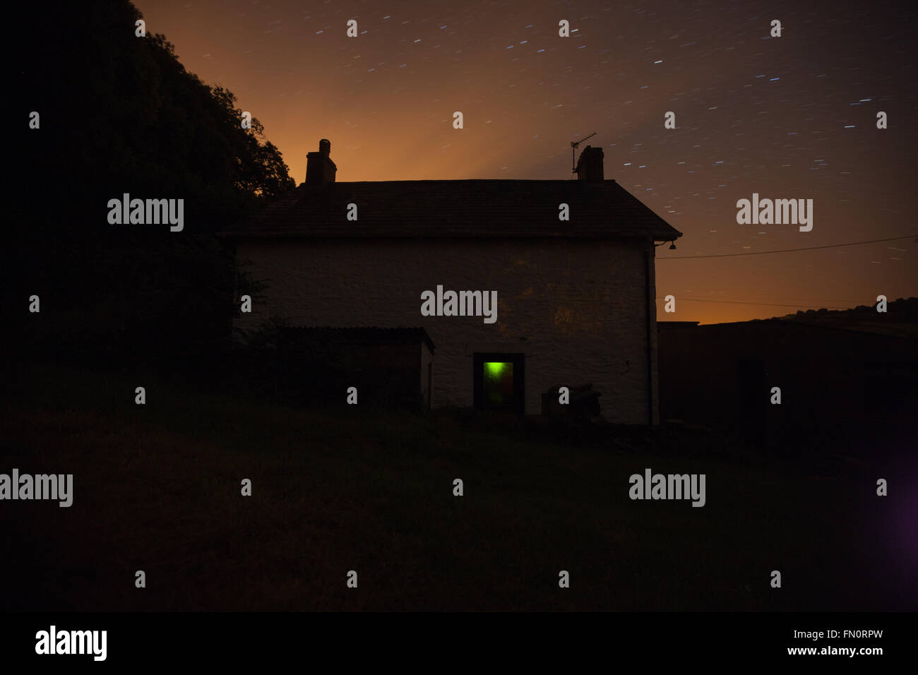 Light pollution in Carmarthenshire.Green light is from the on switch on ...