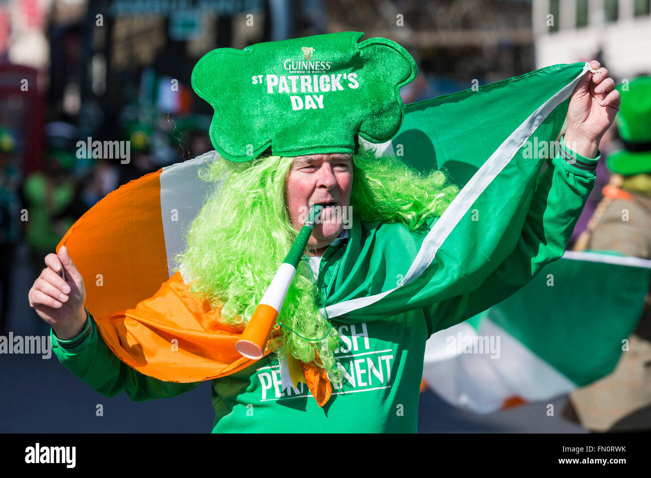 London, UK. 13 March 2016. Irish man in a colourful costume at the ...