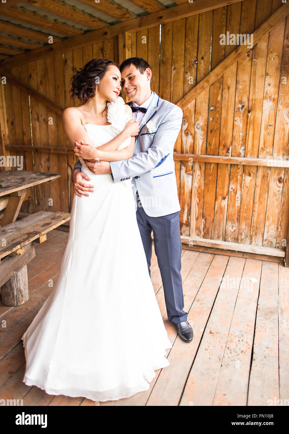 wedding pair hugging and kissing Stock Photo - Alamy