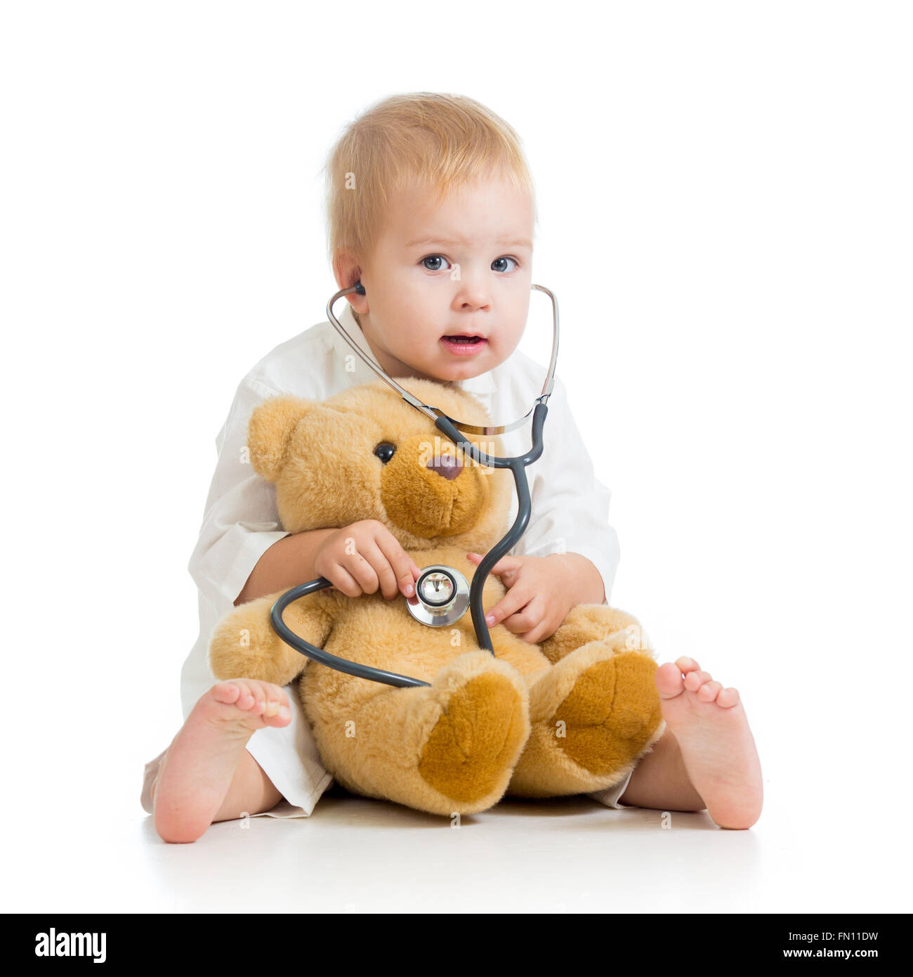 Little kid playing a doctor Stock Photo - Alamy