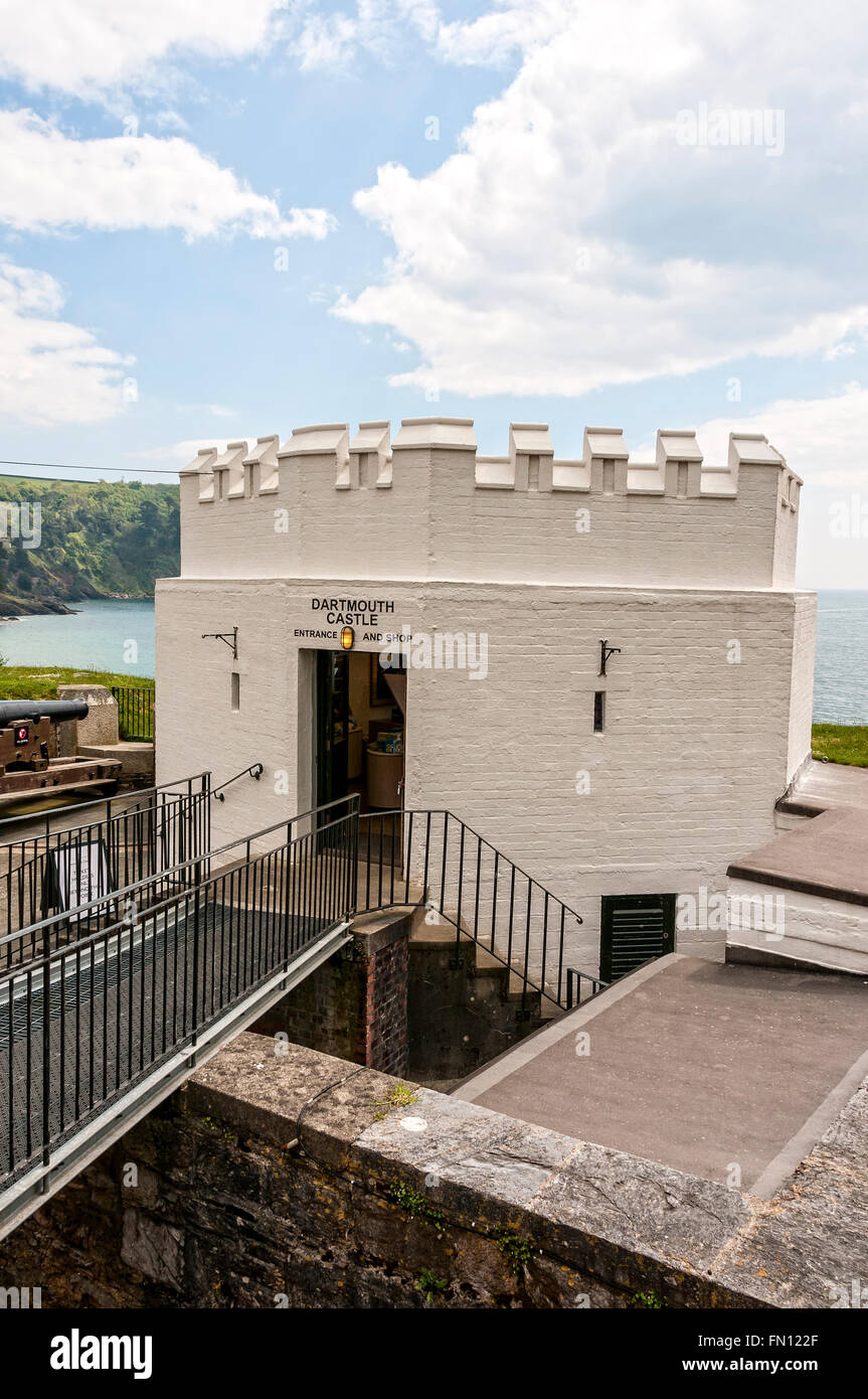 A modern footbridge at ground level crosses the remains of a moat to ...