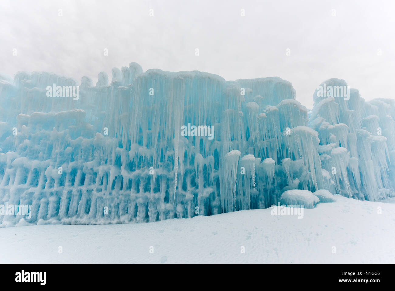 Translucent blue icicles in a frozen ice wall Stock Photo - Alamy
