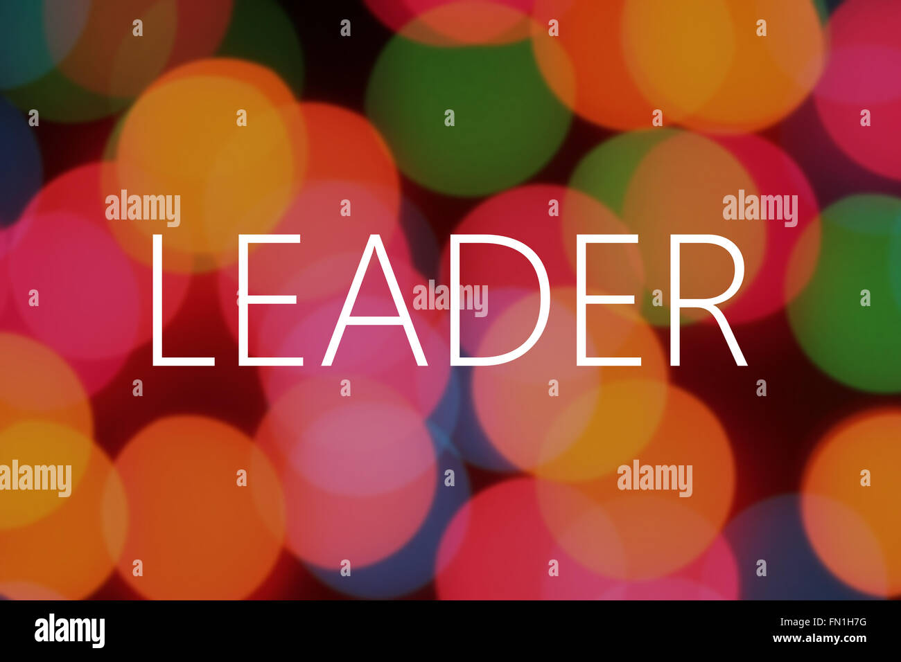 Leader text on colorful bokeh background Stock Photo - Alamy