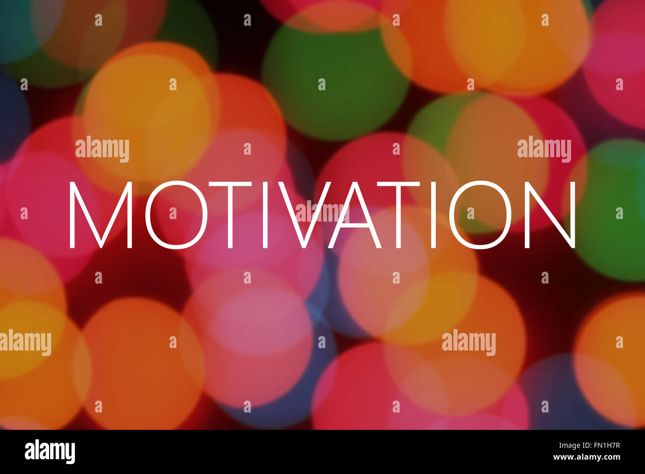 motivation text on colorful bokeh background Stock Photo - Alamy