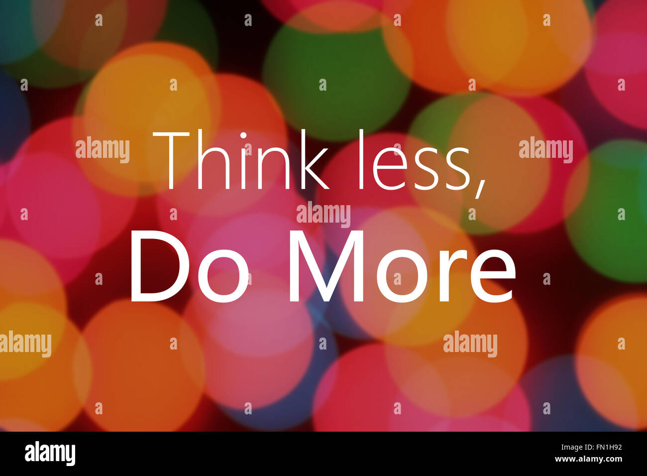 Think less, do more text on colorful bokeh background Stock Photo - Alamy