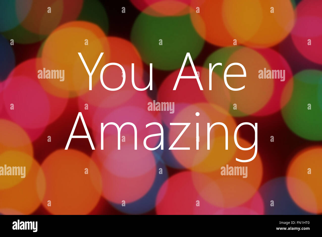You are amazing text on colorful bokeh background Stock Photo - Alamy