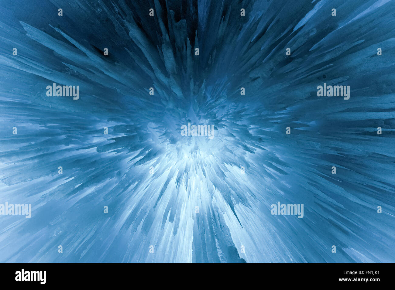 Translucent blue icicles in a frozen ice wall Stock Photo - Alamy