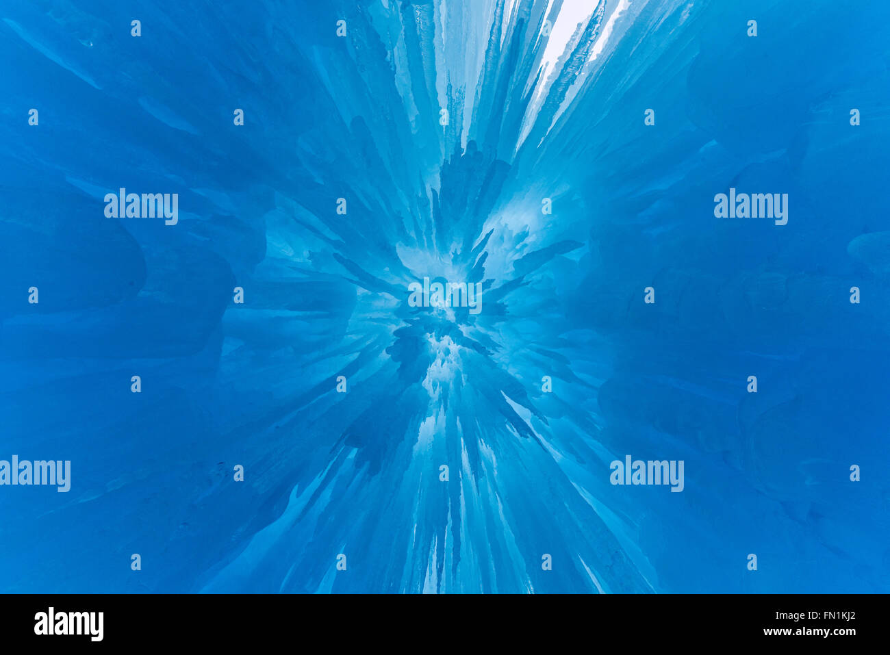 Translucent blue icicles in a frozen ice wall Stock Photo - Alamy