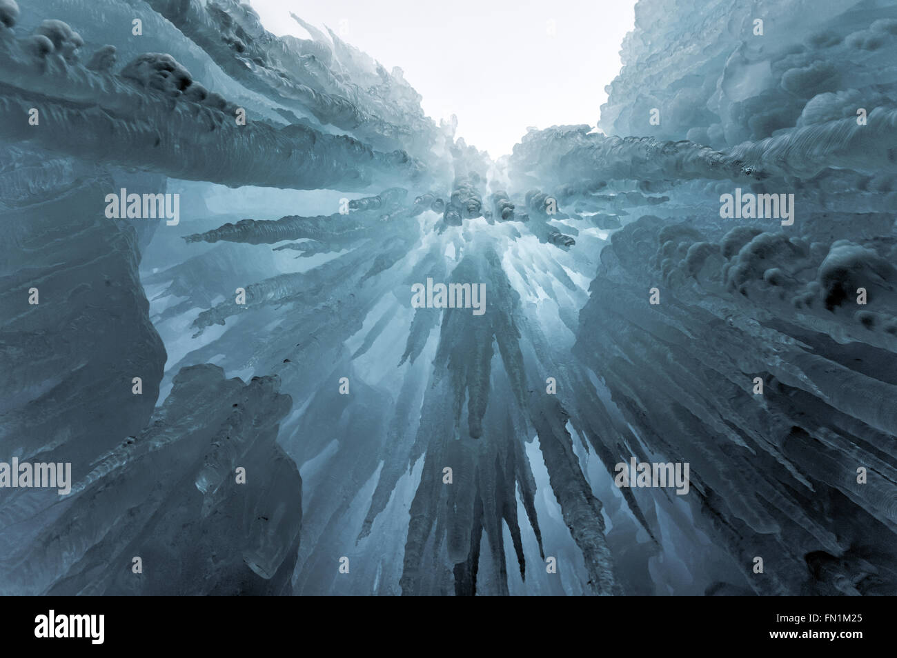 Translucent blue icicles in a frozen ice wall Stock Photo - Alamy