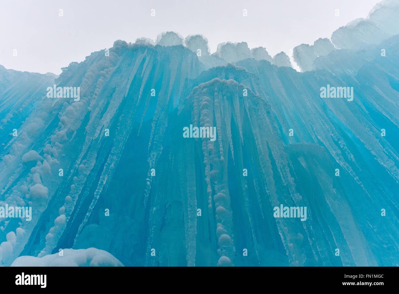 Translucent blue icicles in a frozen ice wall Stock Photo - Alamy