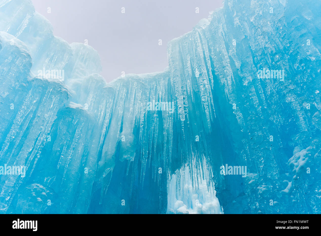 Translucent blue icicles in a frozen ice wall Stock Photo - Alamy