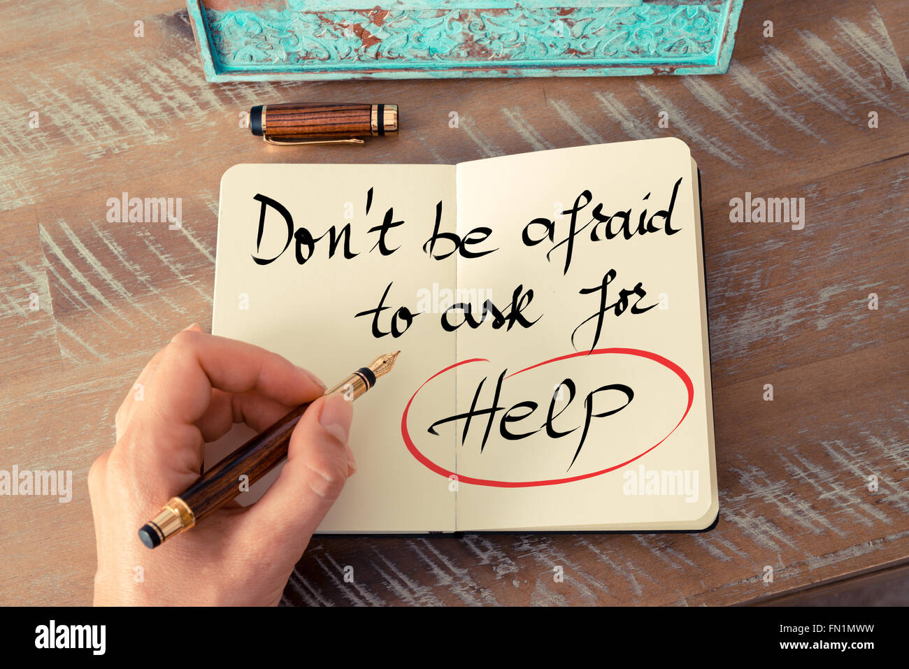 Retro effect and toned image of a woman hand writing a note with a ...