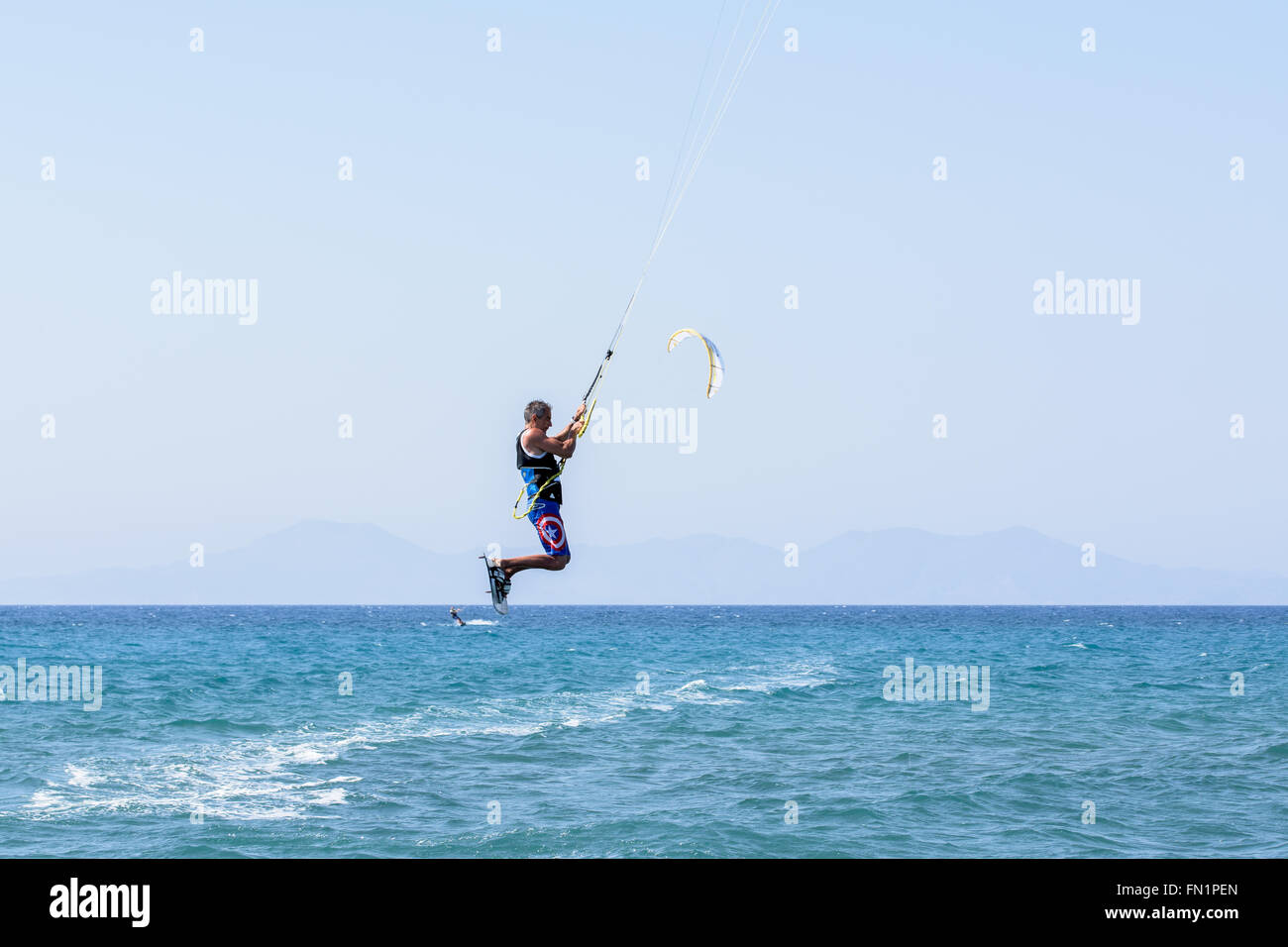 Kiter riding a kite on a sea in Rhodos Stock Photo - Alamy