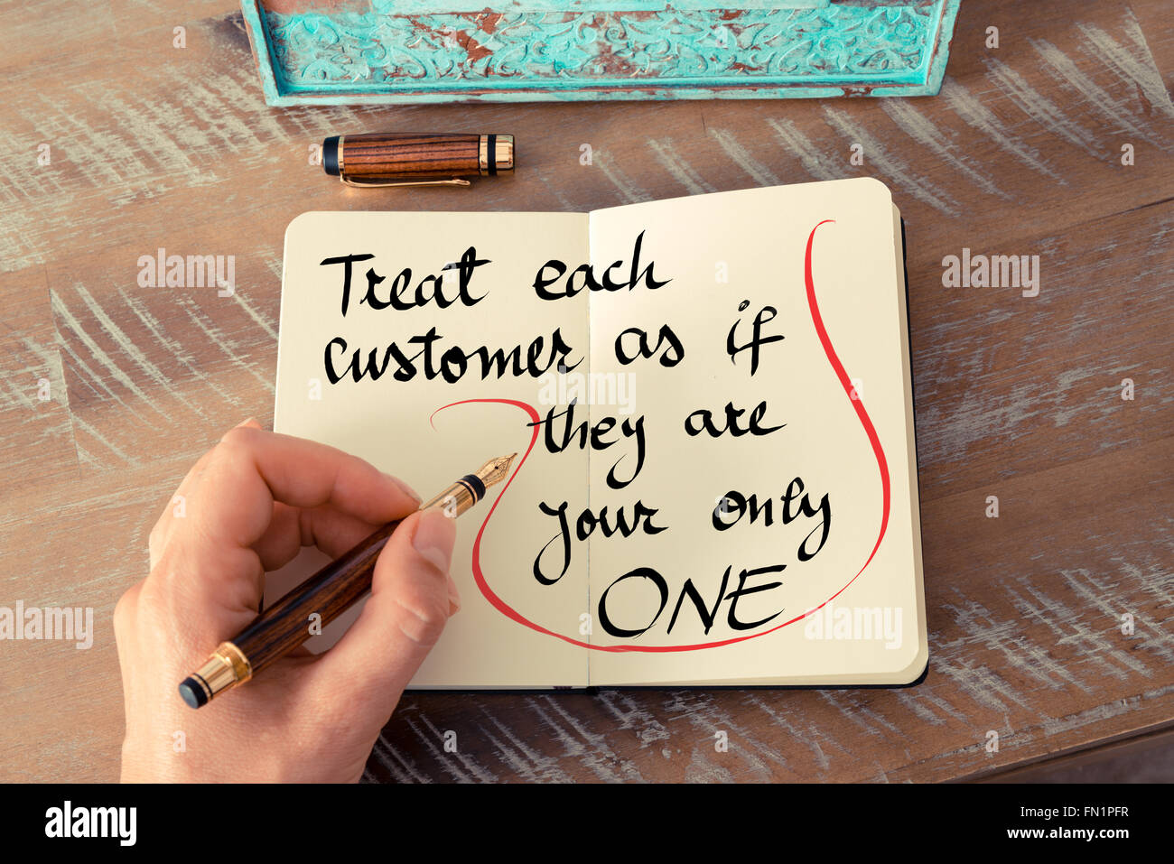 Retro effect and toned image of a woman hand writing a note with a ...