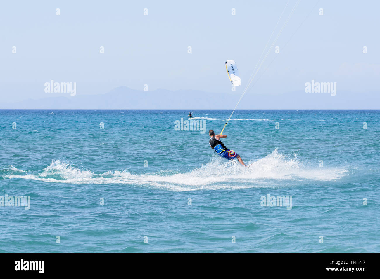 Kiter riding a kite on a sea in Rhodos Stock Photo - Alamy