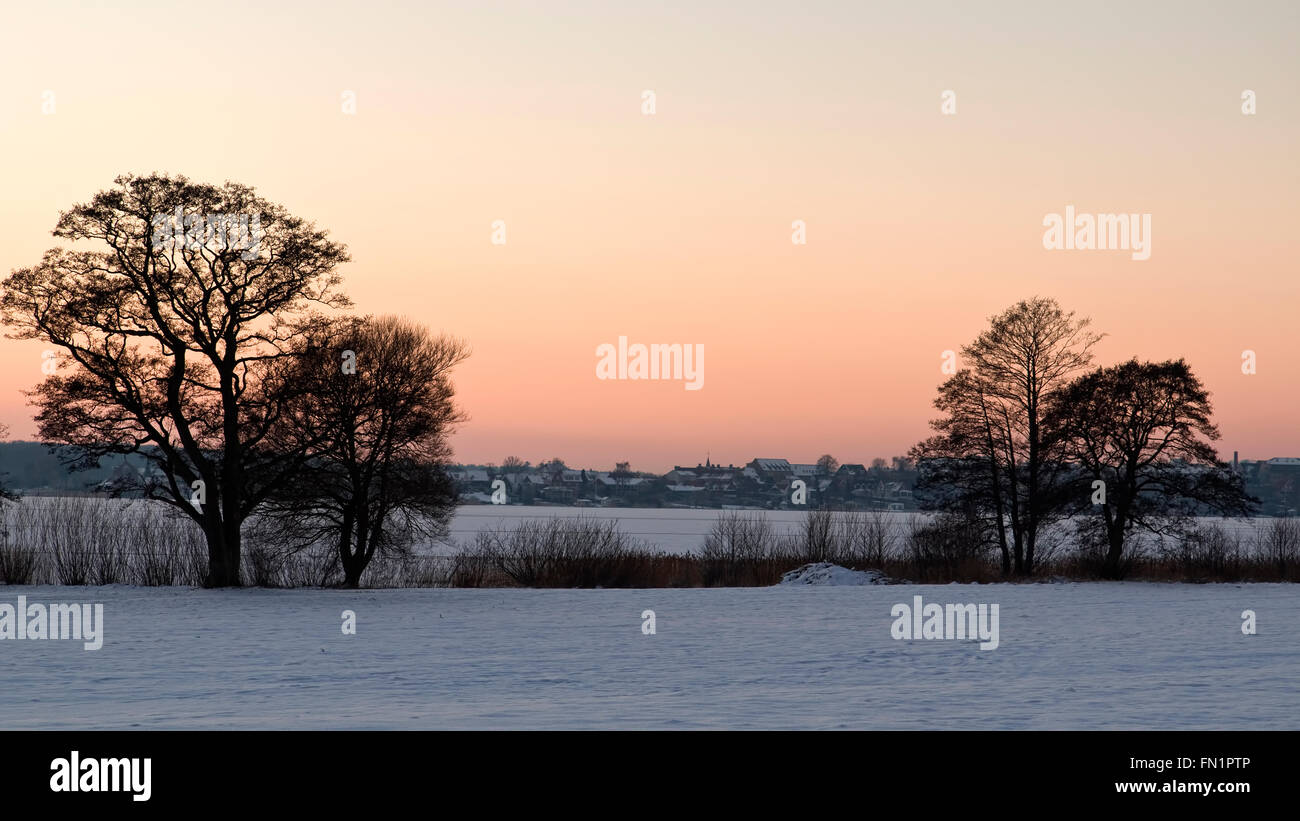 Sunset over a frozen lake at Skanderborg, Denmark. Panorama Stock Photo ...