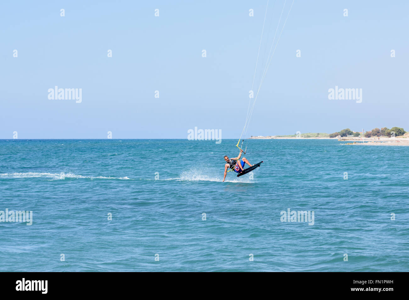 Kiter riding a kite on a sea in Rhodos Stock Photo - Alamy