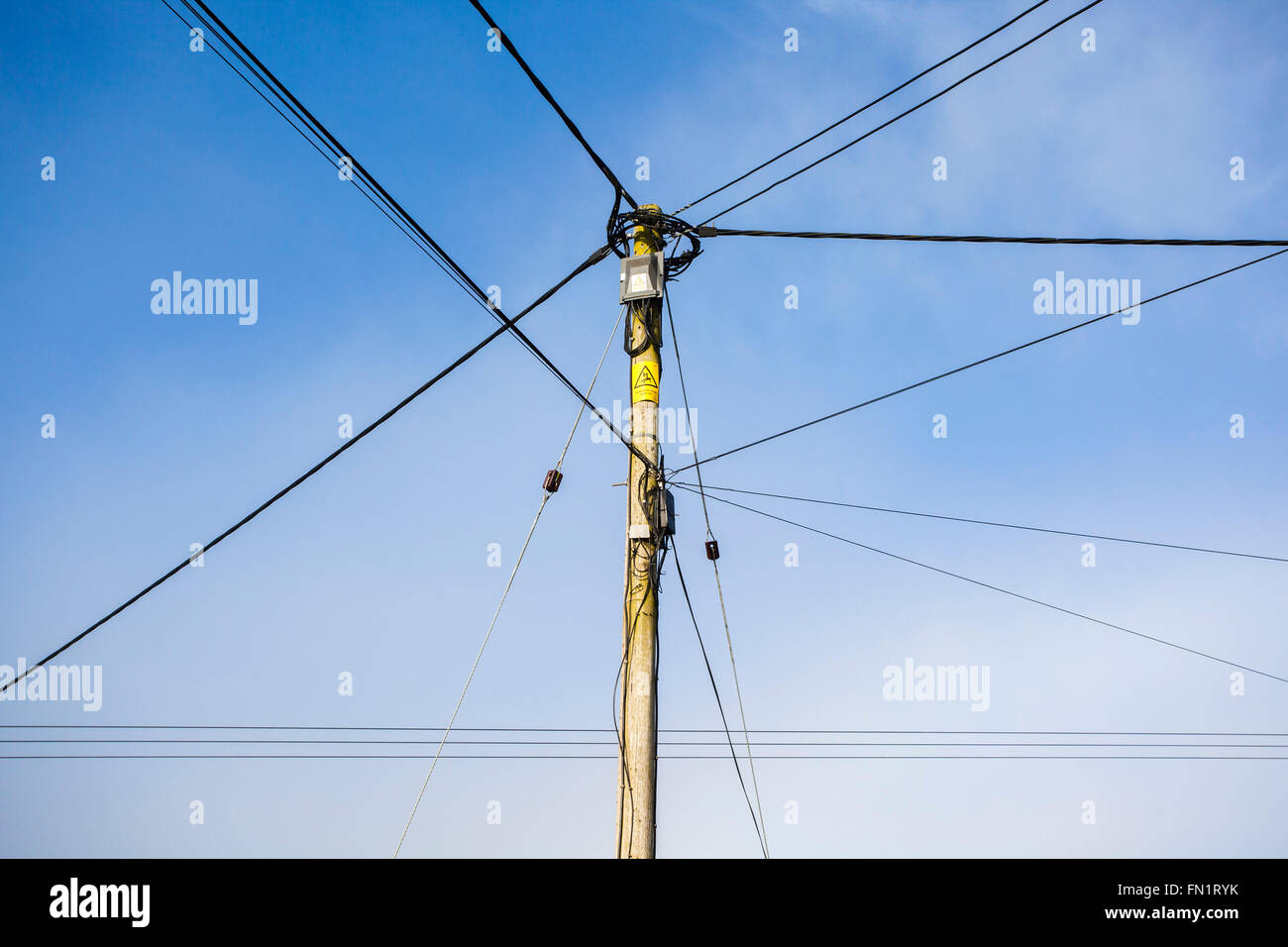 A tangled web of electrical power lines adn telecommunication cables ...