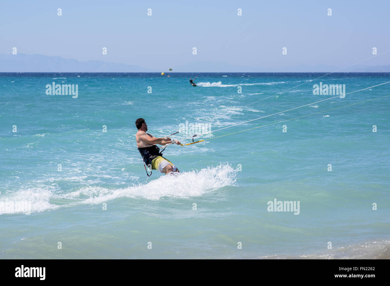 Kiter riding a kite on a sea in Rhodos Stock Photo - Alamy