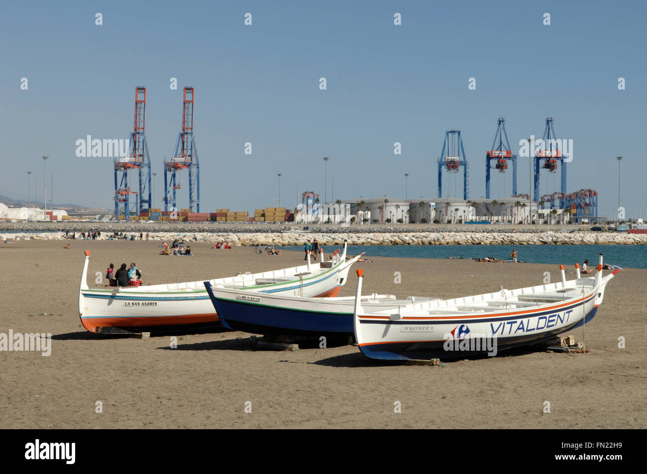 Fishing boats on beach in front of Port of Malaga Spain Stock Photo - Alamy