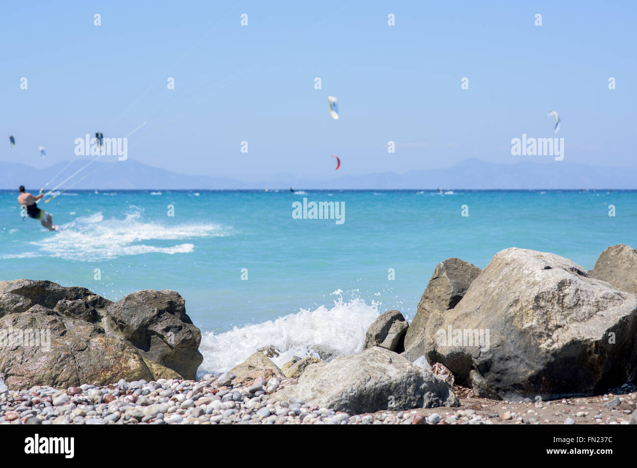 Kiter riding a kite on a sea in Rhodos Stock Photo - Alamy
